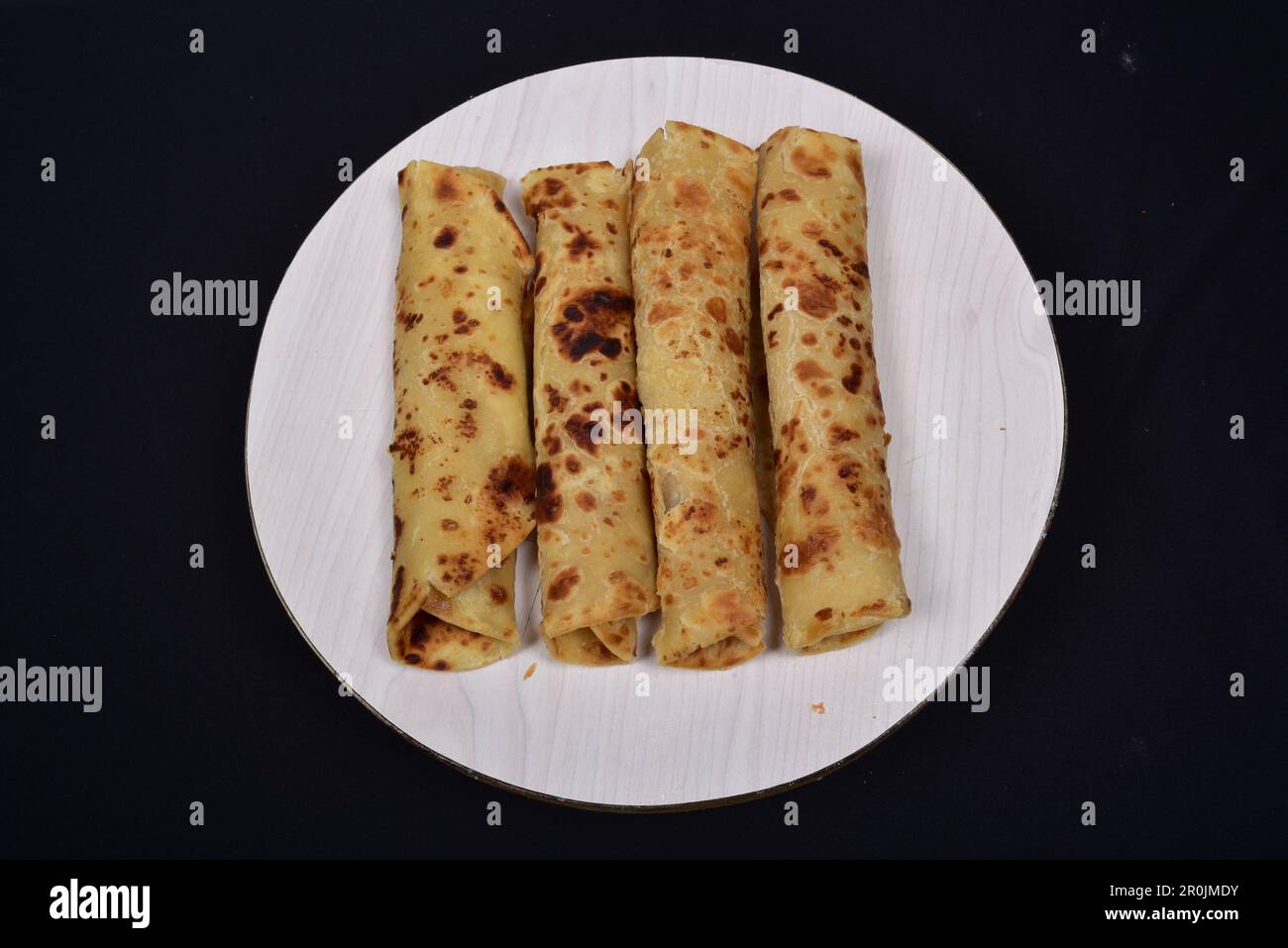 African Chapati rolls on a black background Stock Photo - Alamy