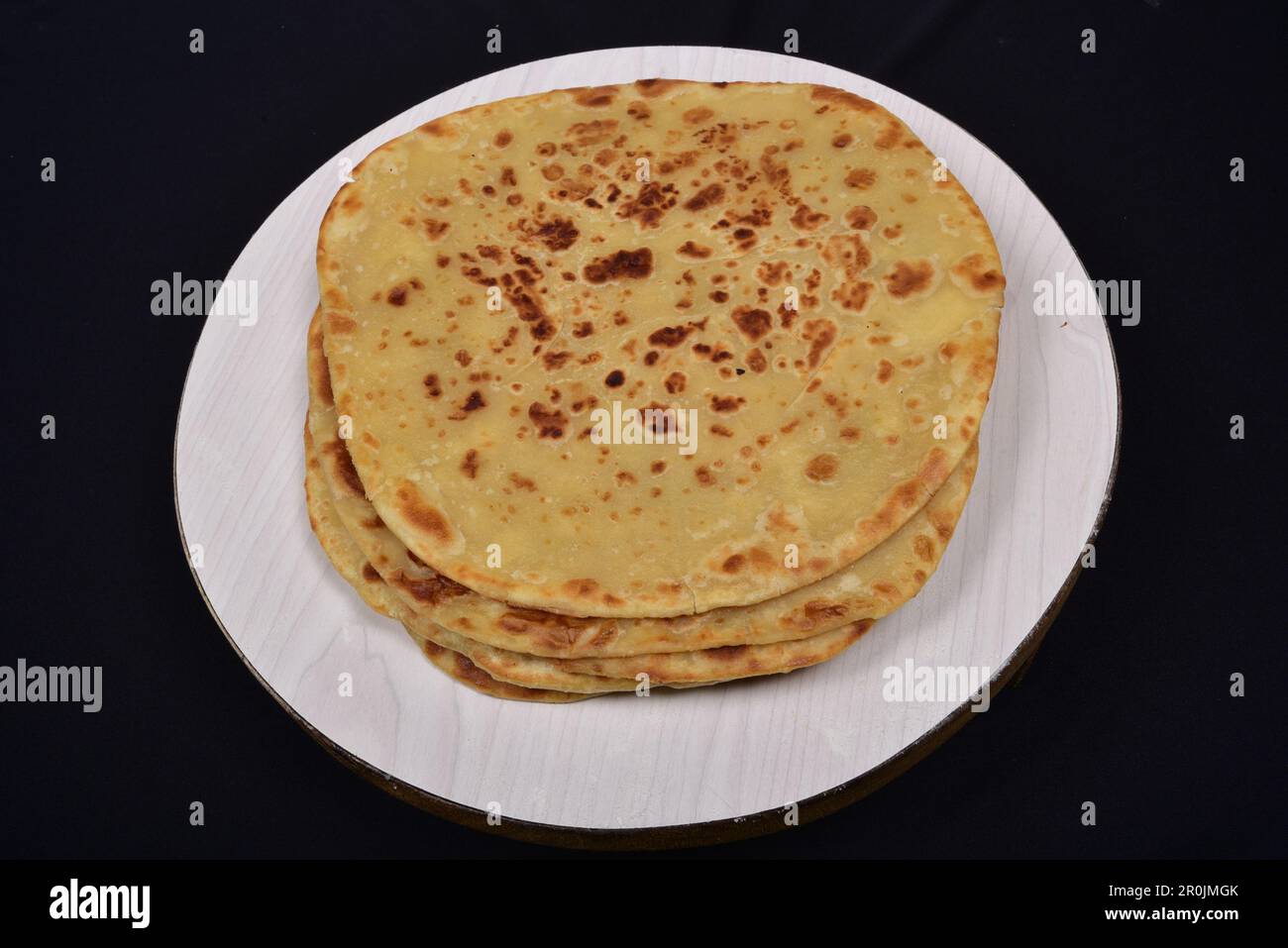 African Chapati on a black background Stock Photo - Alamy