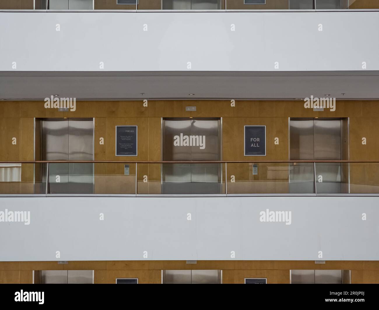 Three parallel running elevators with stainless steel doors Stock Photo ...