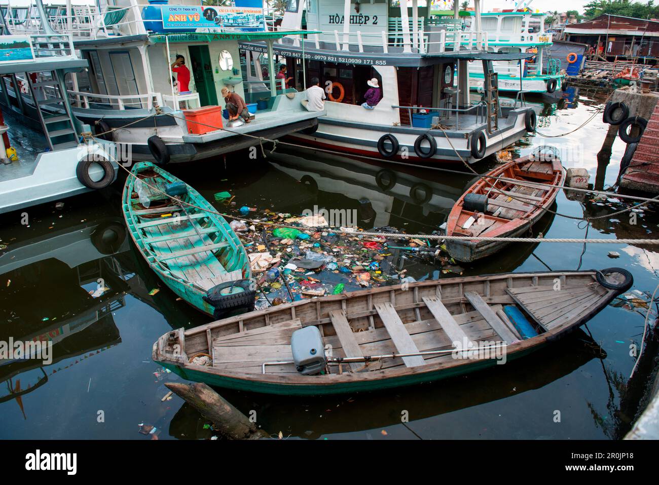 Garbage floats among boats in harbor, Phu Quoc, Mekong Delta, Vietnam ...
