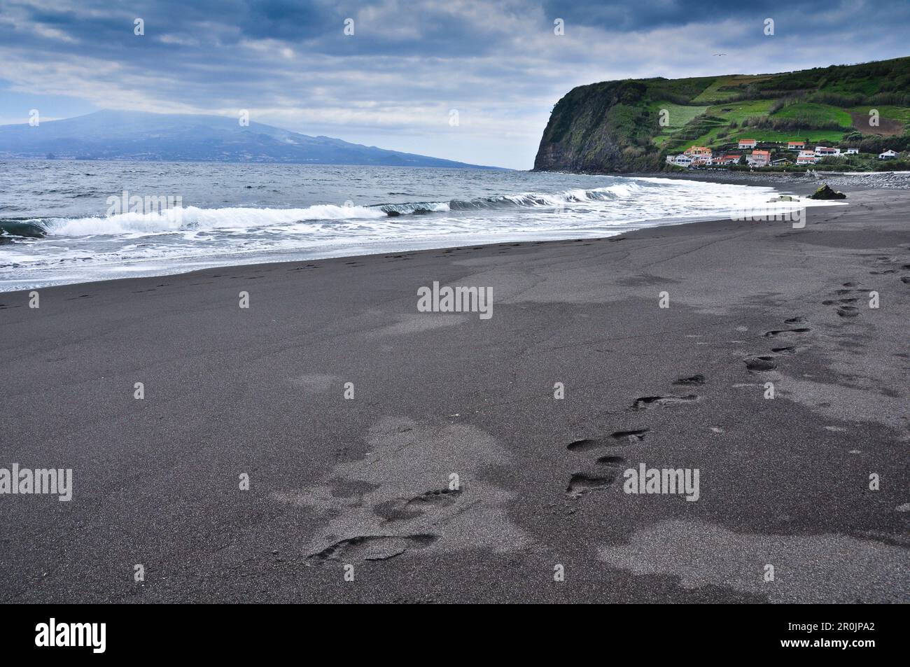 Lava beach Praia do Almoxarife with cliffs, terraces and village ...