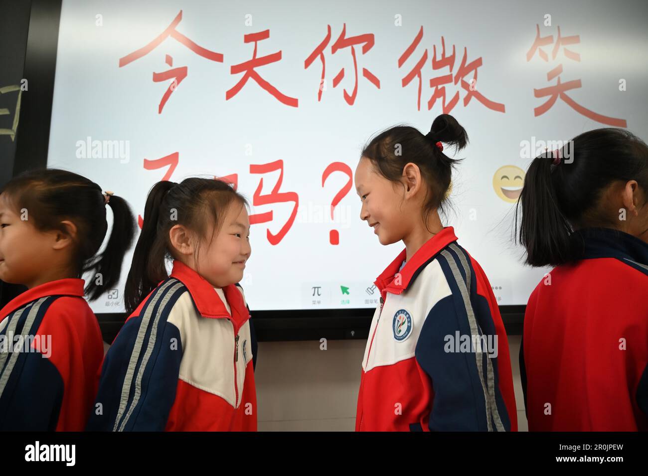**CHINESE MAINLAND, HONG KONG, MACAU AND TAIWAN OUT** Students smile to ...
