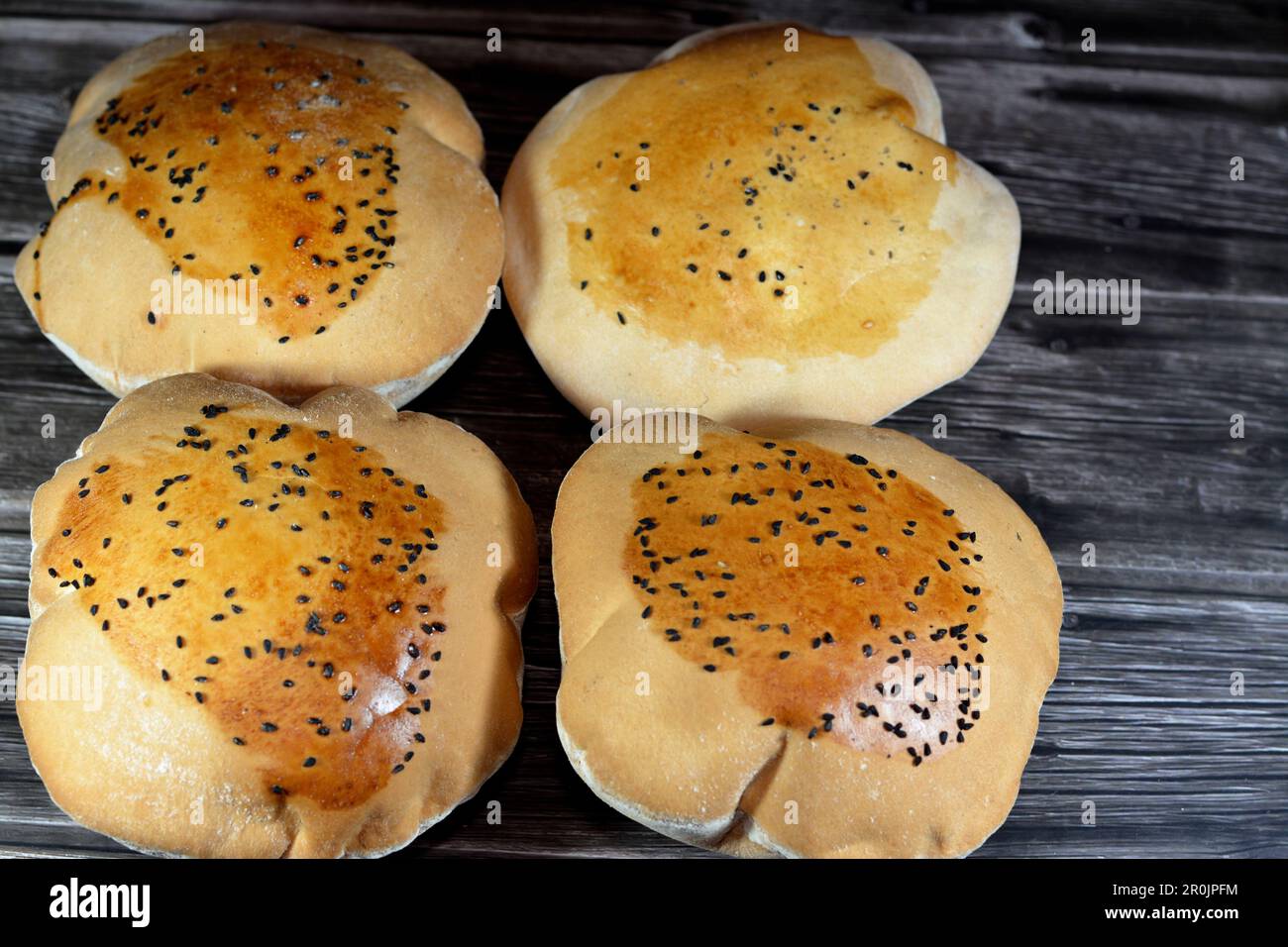 Egyptian Mahlab bread, puff thin, crispy and delicious with black seed baraka seeds on top, made ...