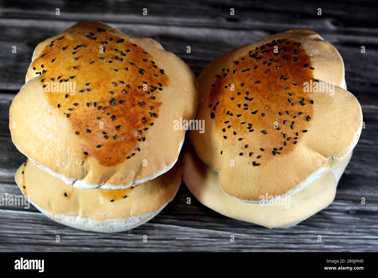 Egyptian Mahlab bread, puff thin, crispy and delicious with black seed baraka seeds on top, made ...