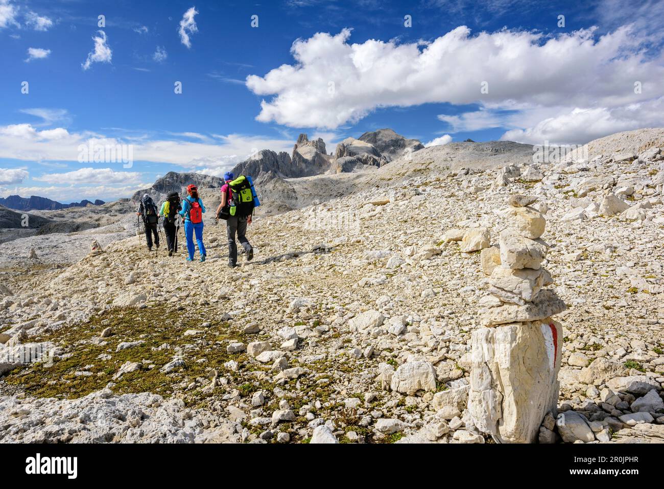 Several persons hiking on Pala plateau, Pala range, Dolomites, UNESCO ...