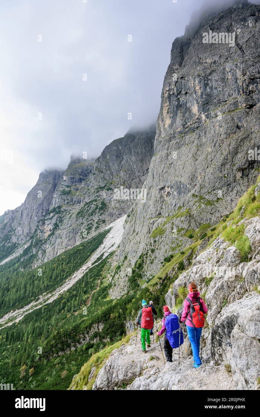 Several persons descending through valley Val Canali, Rifugio Pradidali ...
