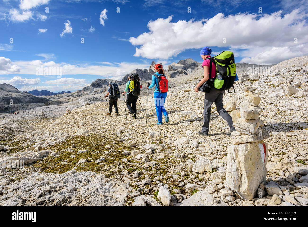 Several persons hiking on Pala plateau, Pala range, Dolomites, UNESCO ...