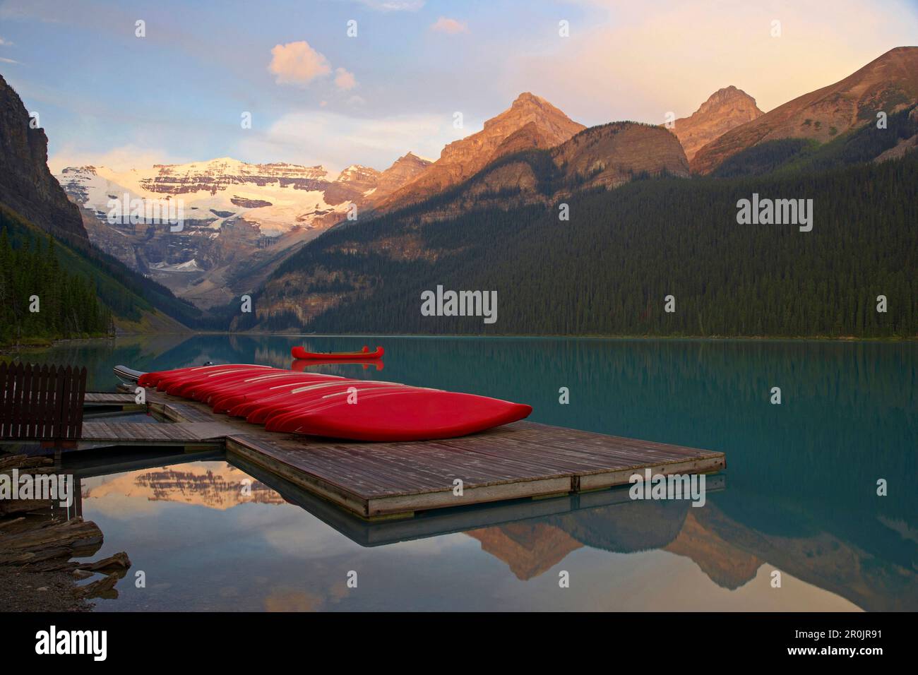 Victoria Glacier and canoes on Lake Louise, Sunrise, Banff National ...