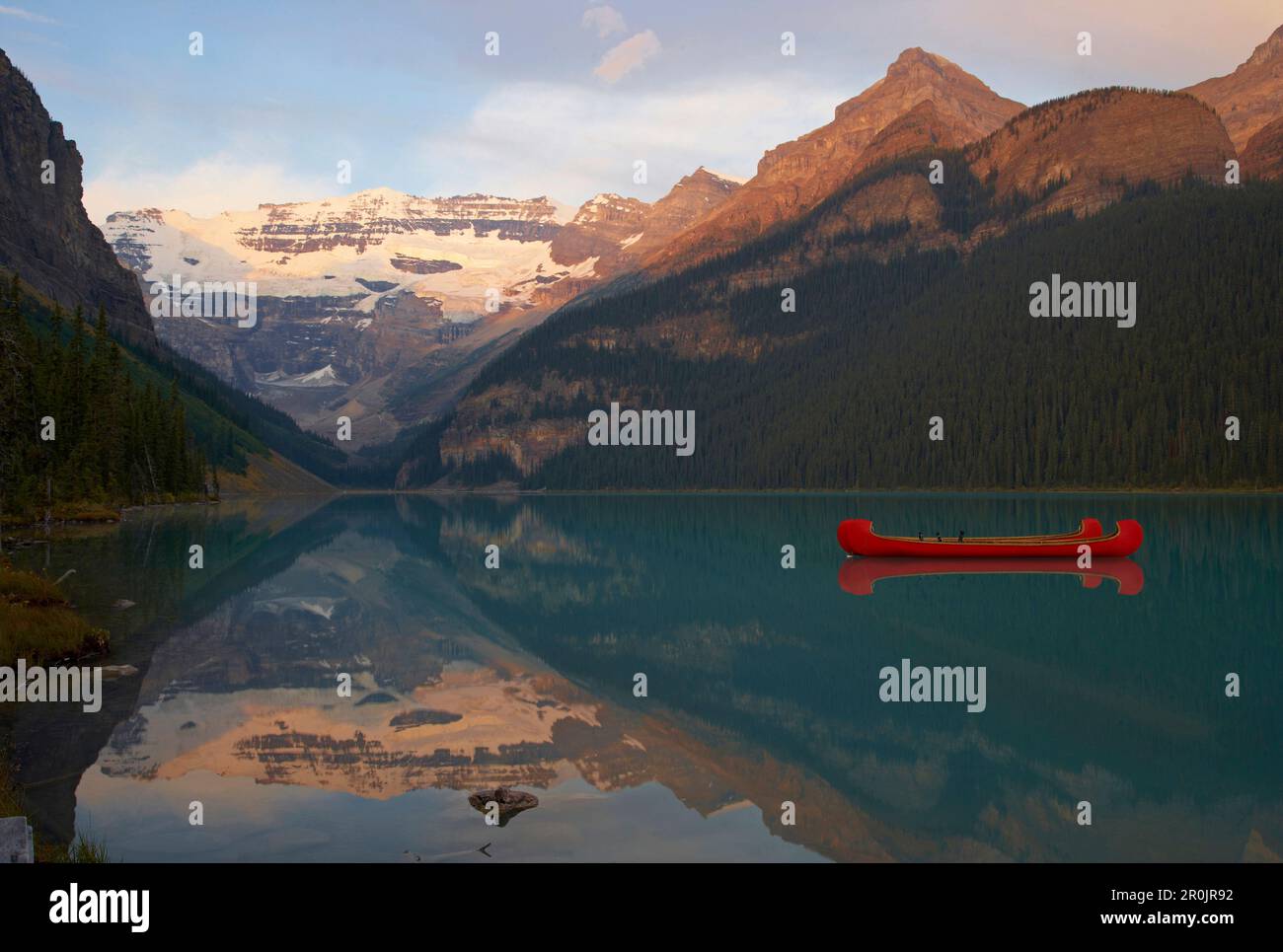 Victoria Glacier and canoes on Lake Louise, Sunrise, Banff National ...
