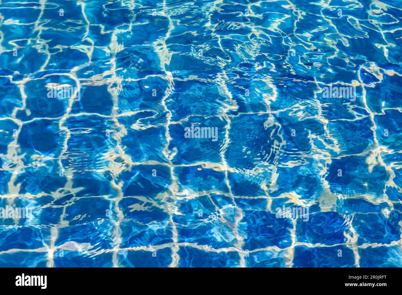 Blue color water in swimming pool rippled background Stock Photo - Alamy