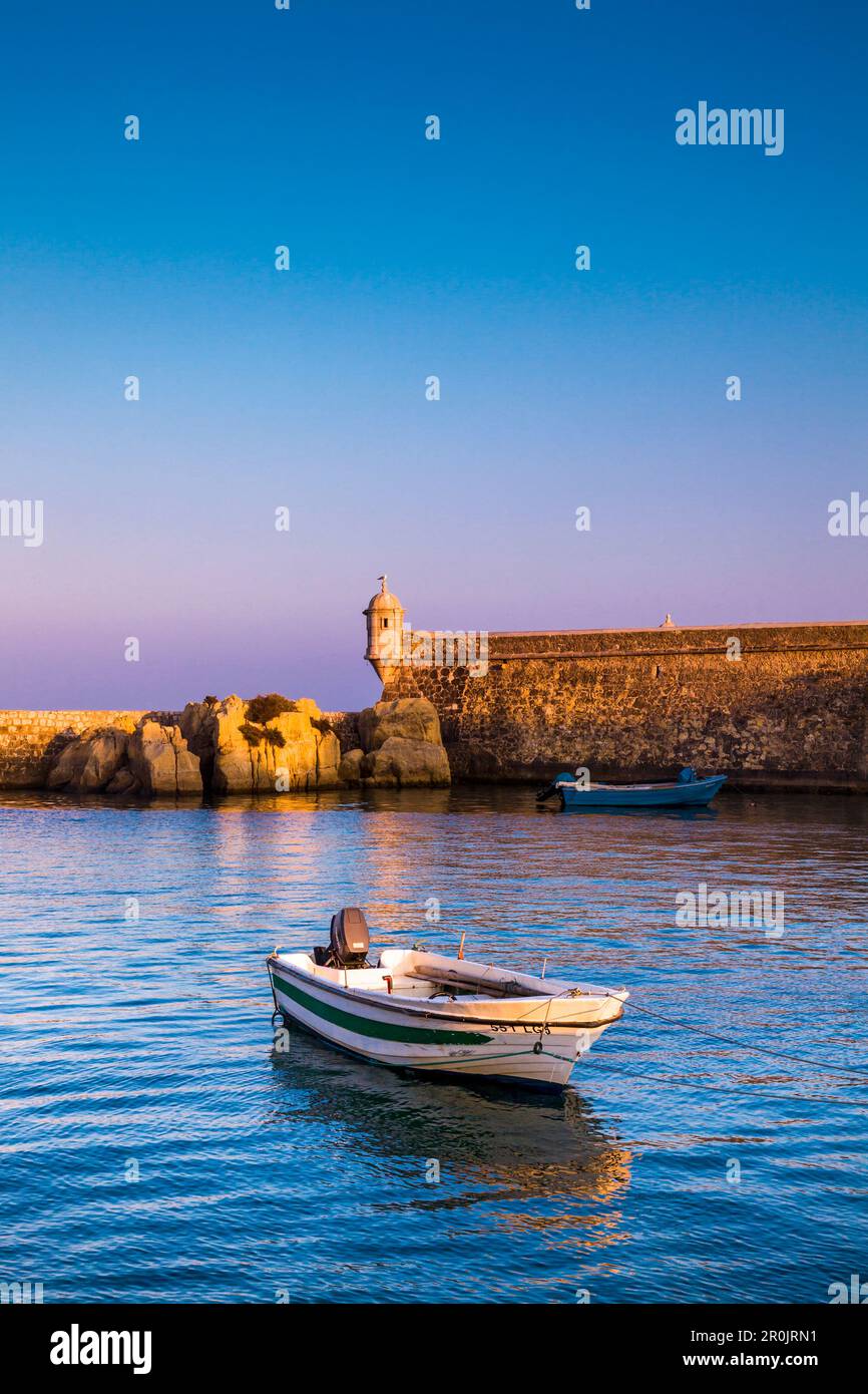 Castle Forte da Bandeira at dusk, Lagos, Algarve, Portugal Stock Photo ...