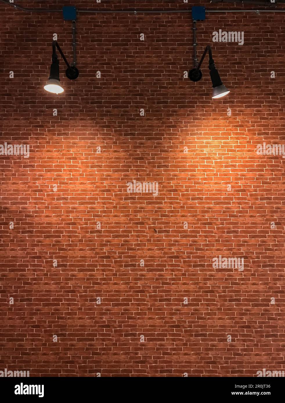 Spot light and brick background Stock Photo - Alamy
