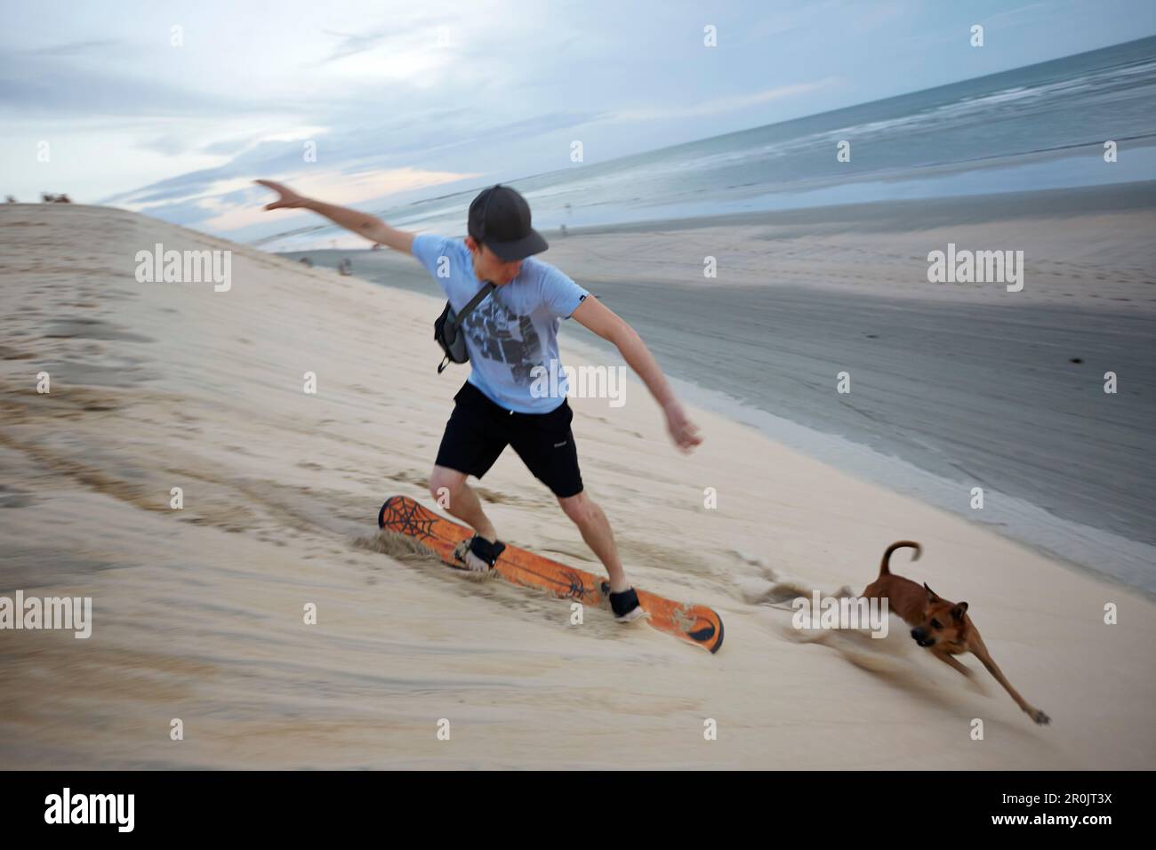 Alex Krex on a sandboard, Duna do Por do Sol (Sunset Dune), tourists in ...
