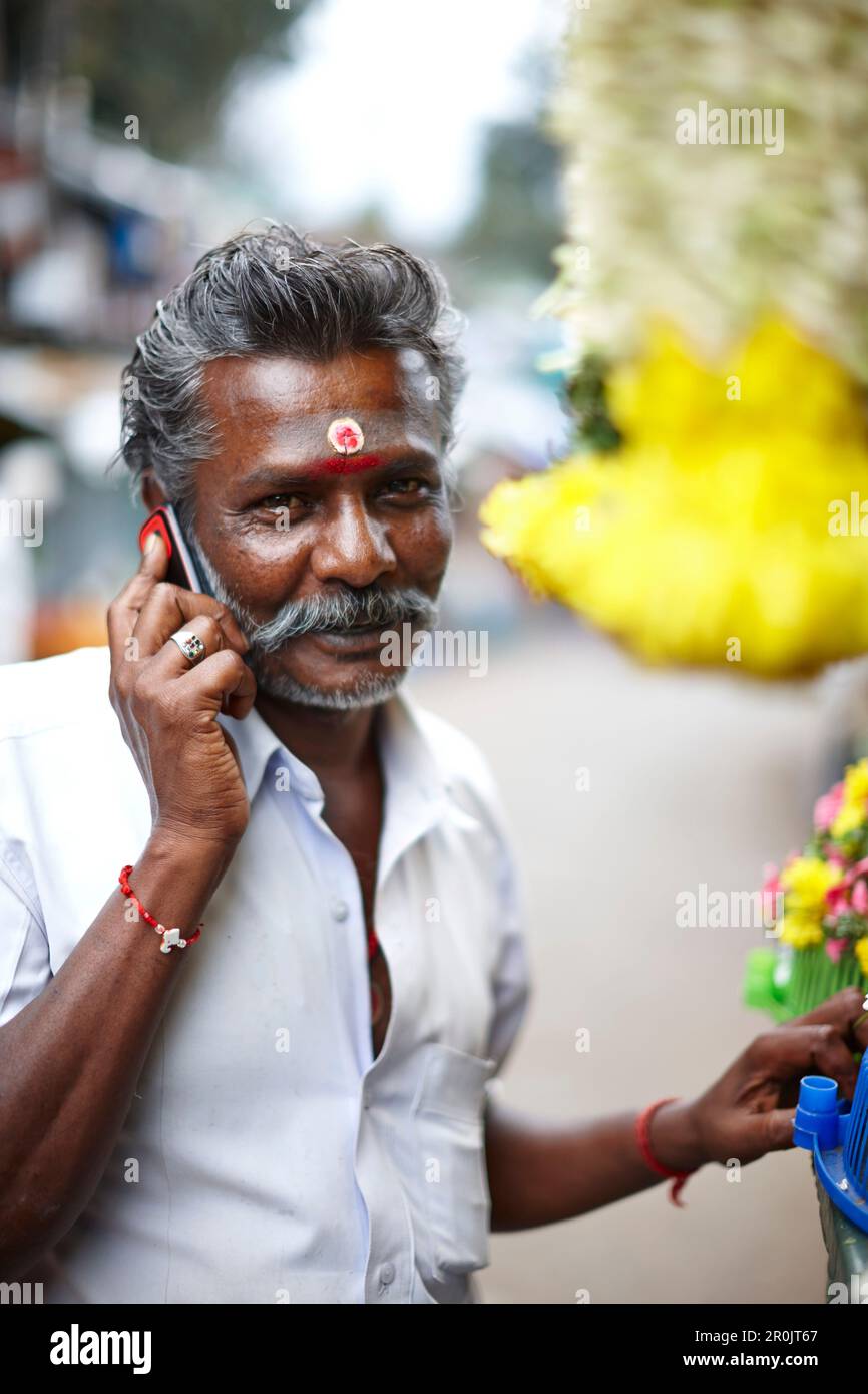 Hindu, customer at a flower stall, market in Valparai, Tamil Nadu ...