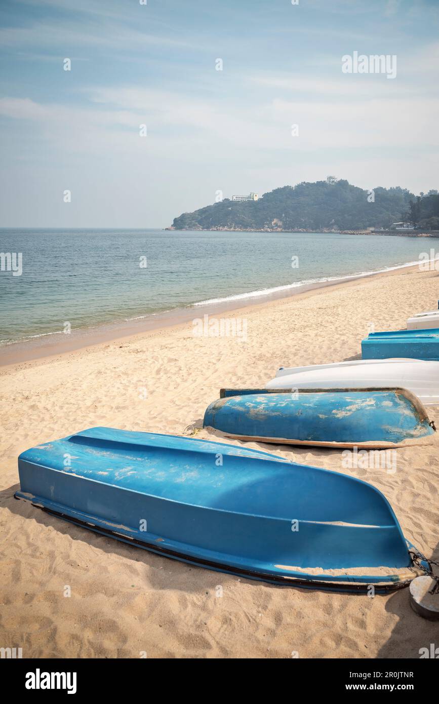 boats lay upside down at bay of Tung Wan Beach, Cheng Chau Island ...