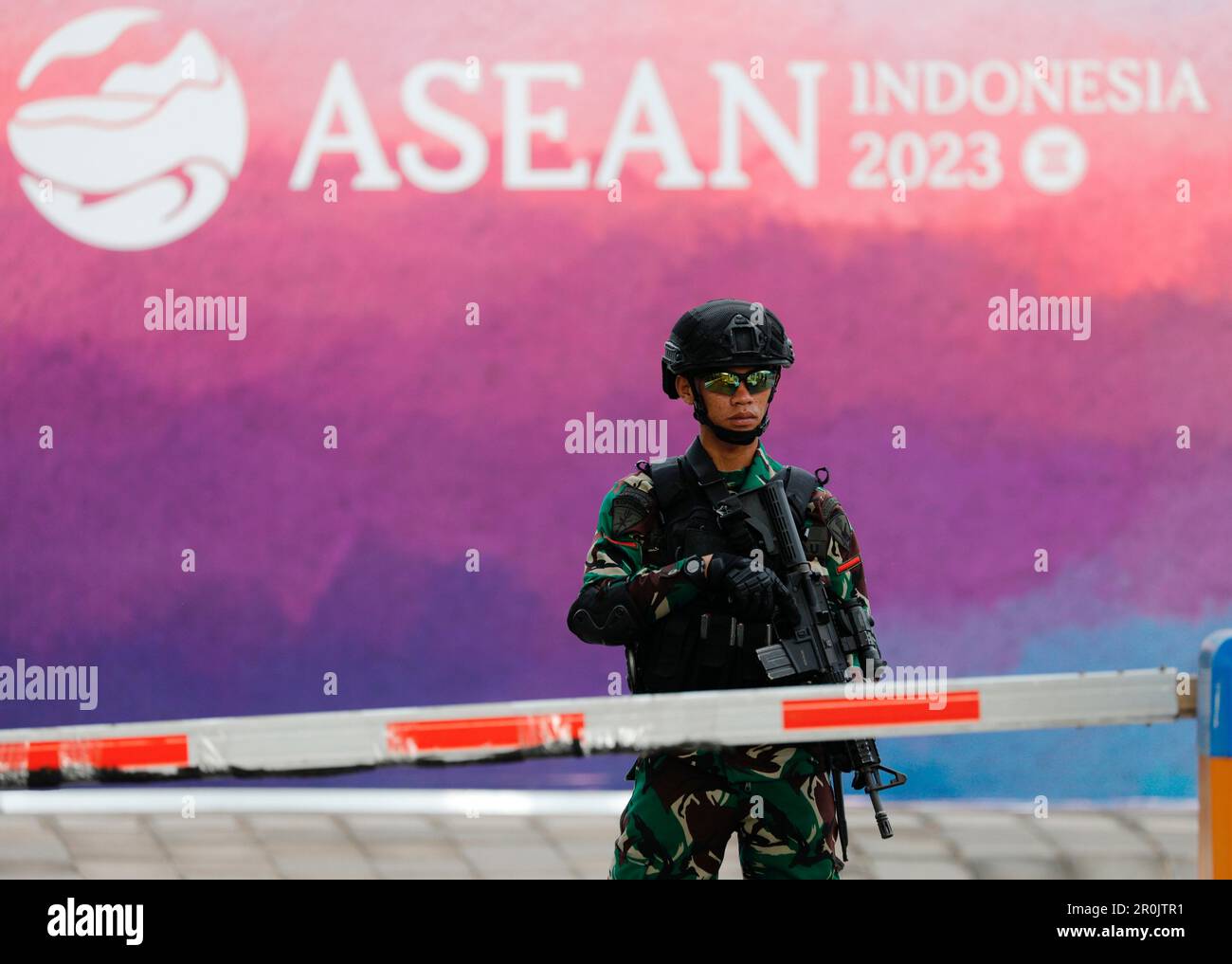 An Indonesian Air Force commando stands guard at Komodo Airport ahead ...