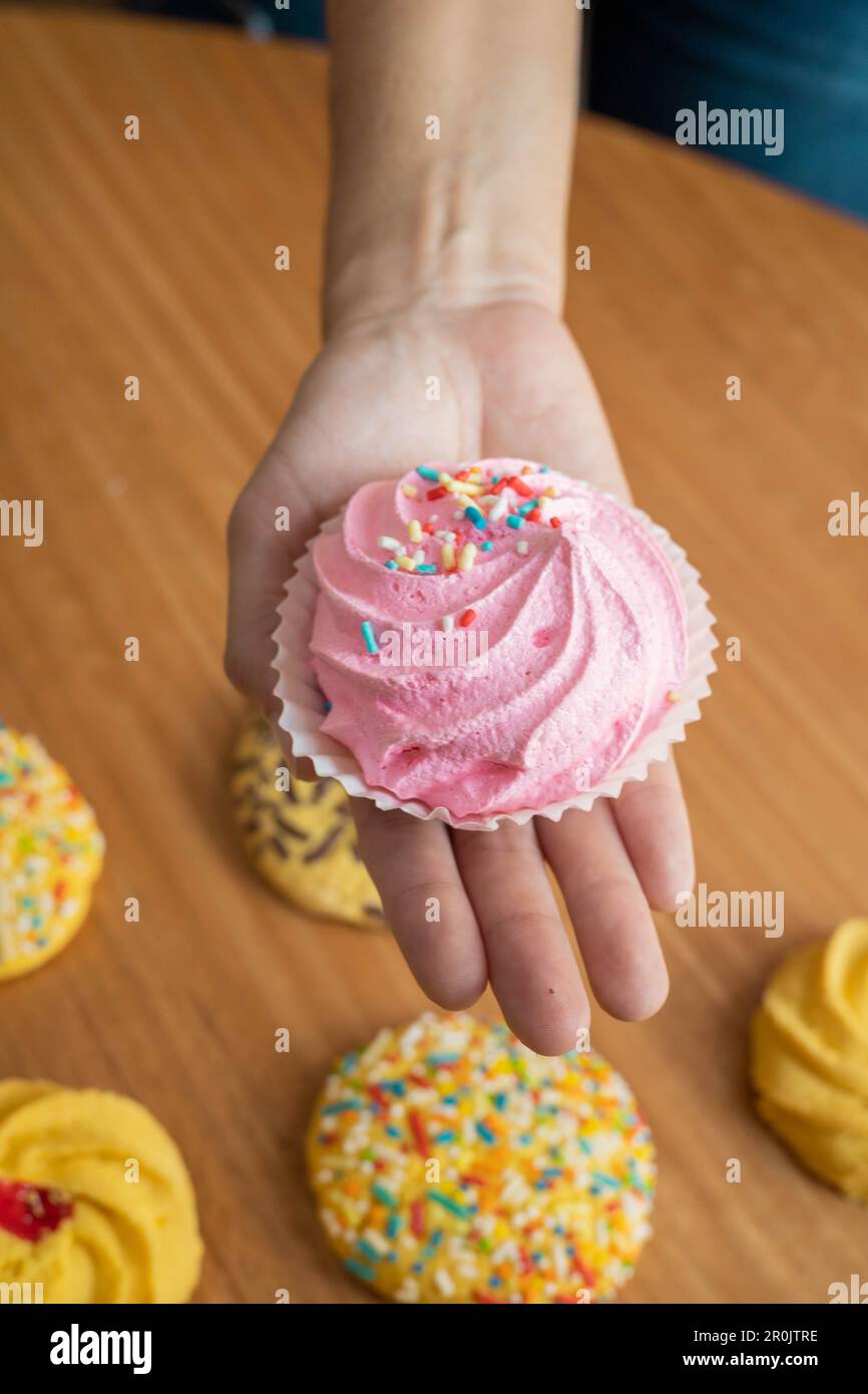 Traditional gourmet type dessert in the hand of a person, typical Latin ...