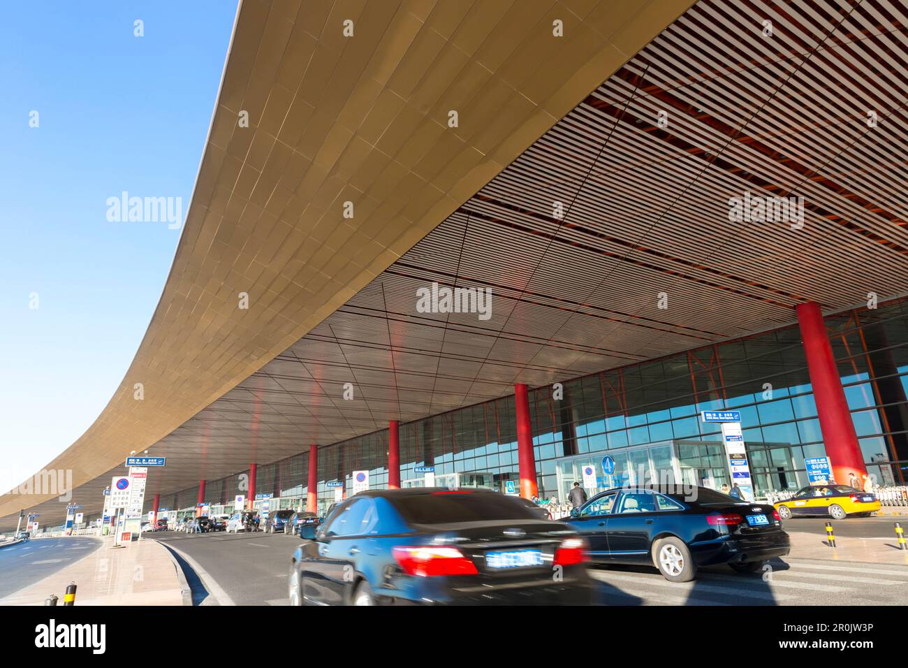 Black cars, Beijing Airport, taxi, cab, yellow roof, red pillars ...