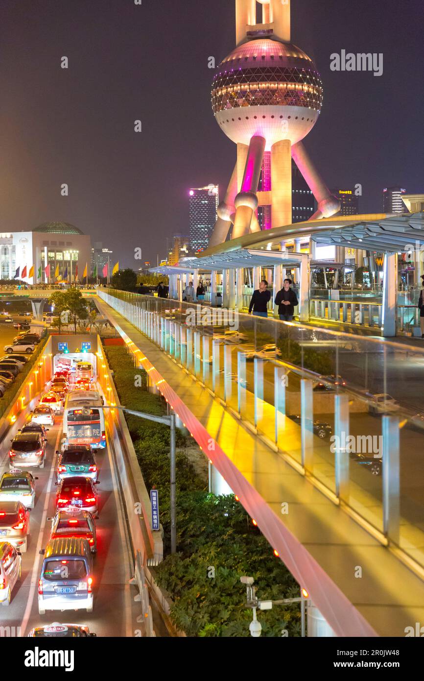 Night, Pudong, Oriental Pearl Tower, people on bridge, walkway, traffic ...