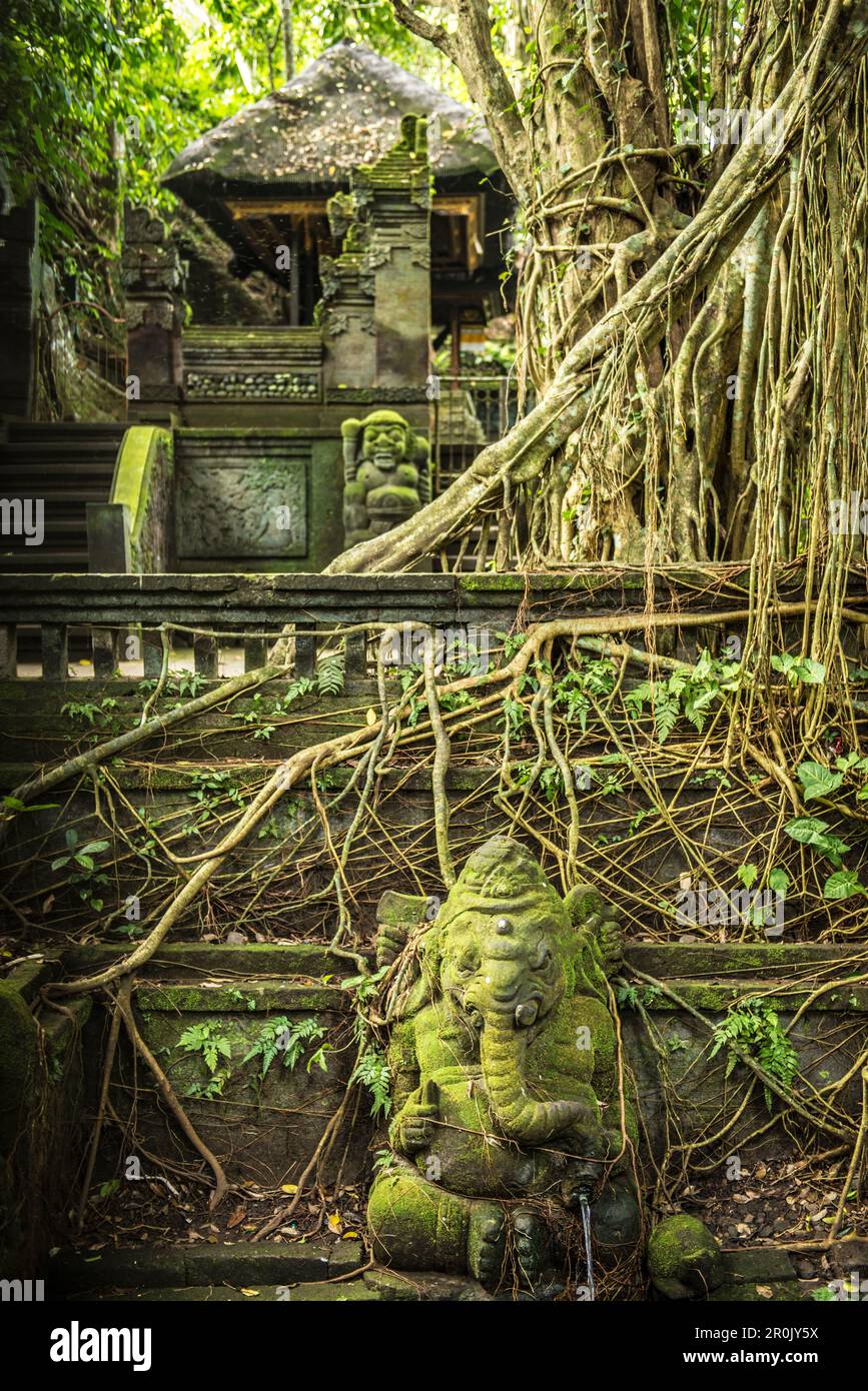 Balinese temple entrance with monkey statues in the temple town of Ubud ...