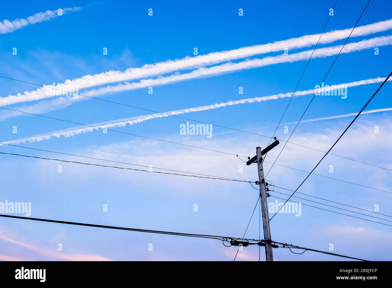 Typical open land phone and power supply lines on wooden posts with ...