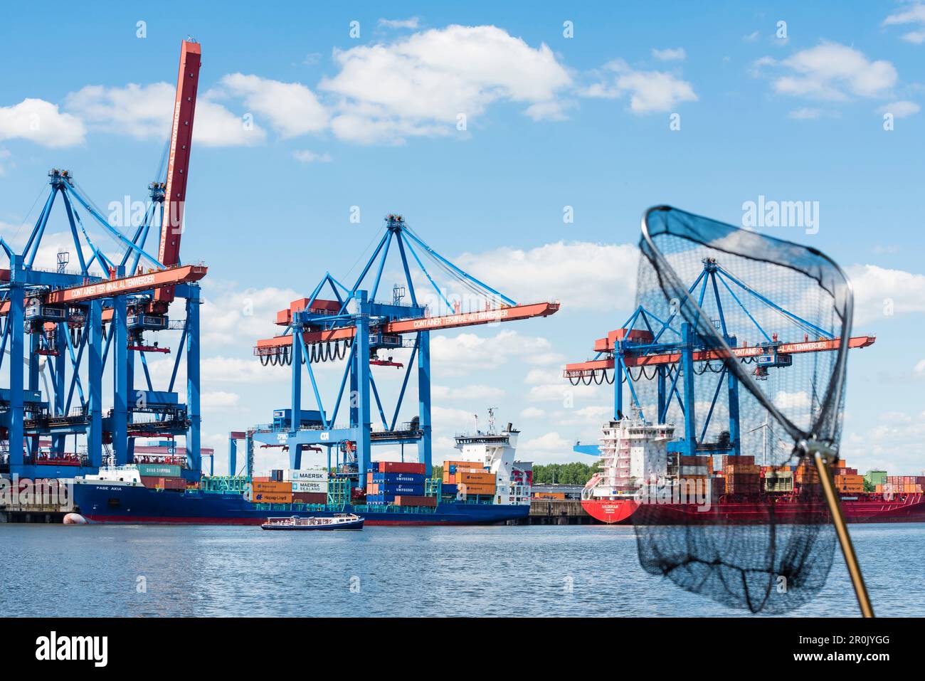 Ships and cranes and a launch during harbour cruise in the harbour ...