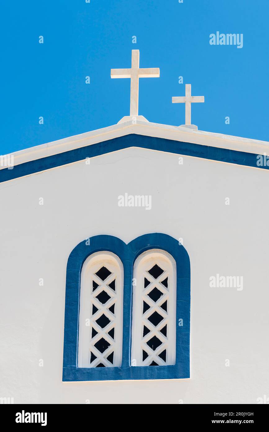 Side view with window and 2 crosses of a traditionally built blue white ...