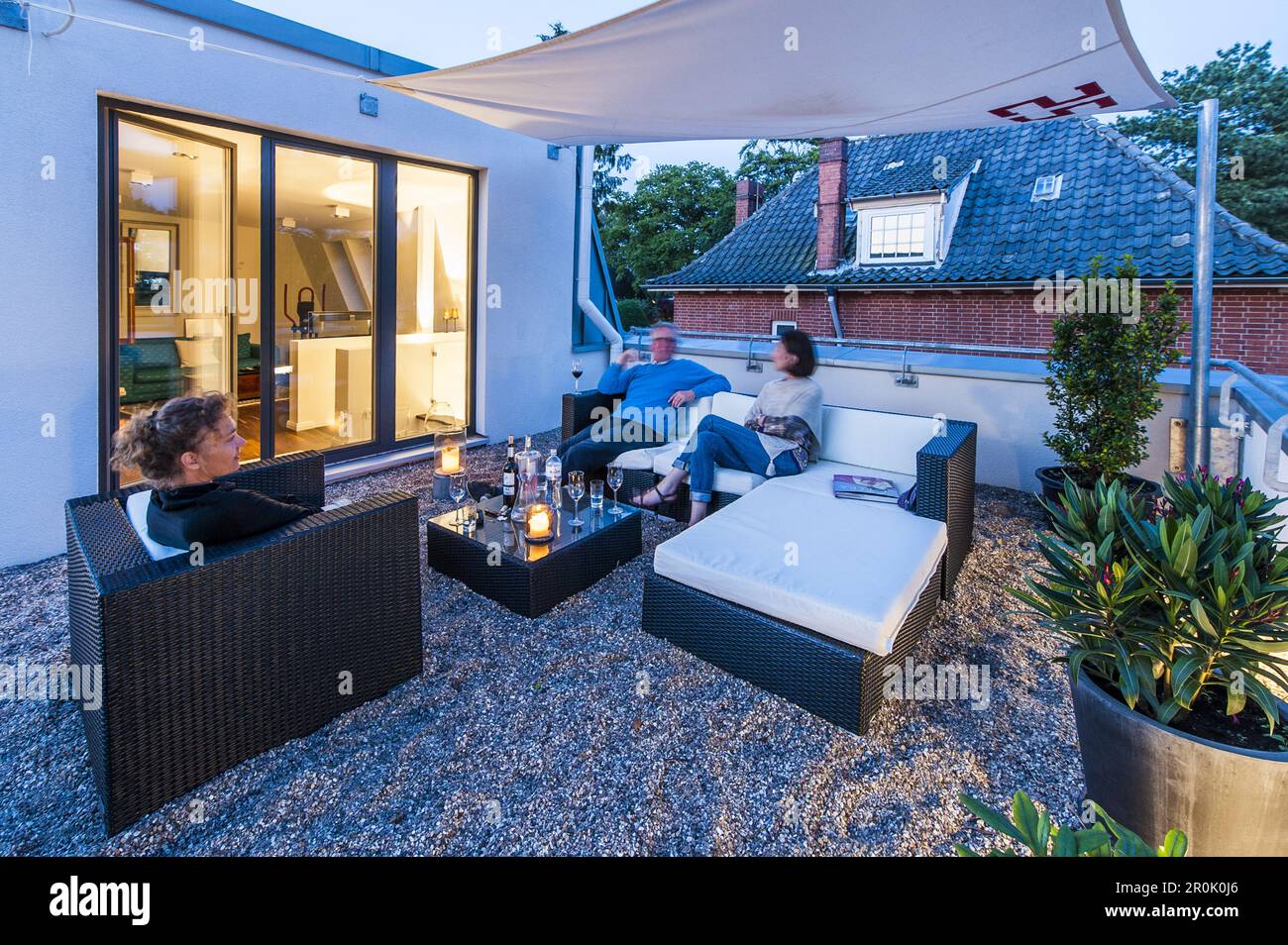 people on a roof terrace of a modern sigle-family house in Hamburg ...