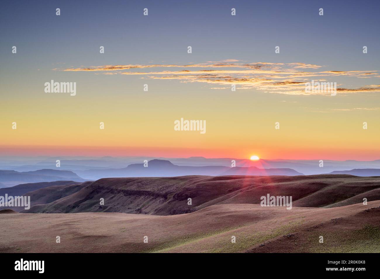 Sunrise above grassland of Little Berg, Giant's Castle, Drakensberg ...