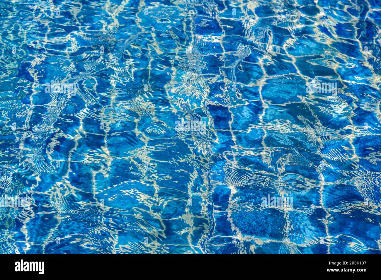 Blue color water in swimming pool rippled background Stock Photo - Alamy