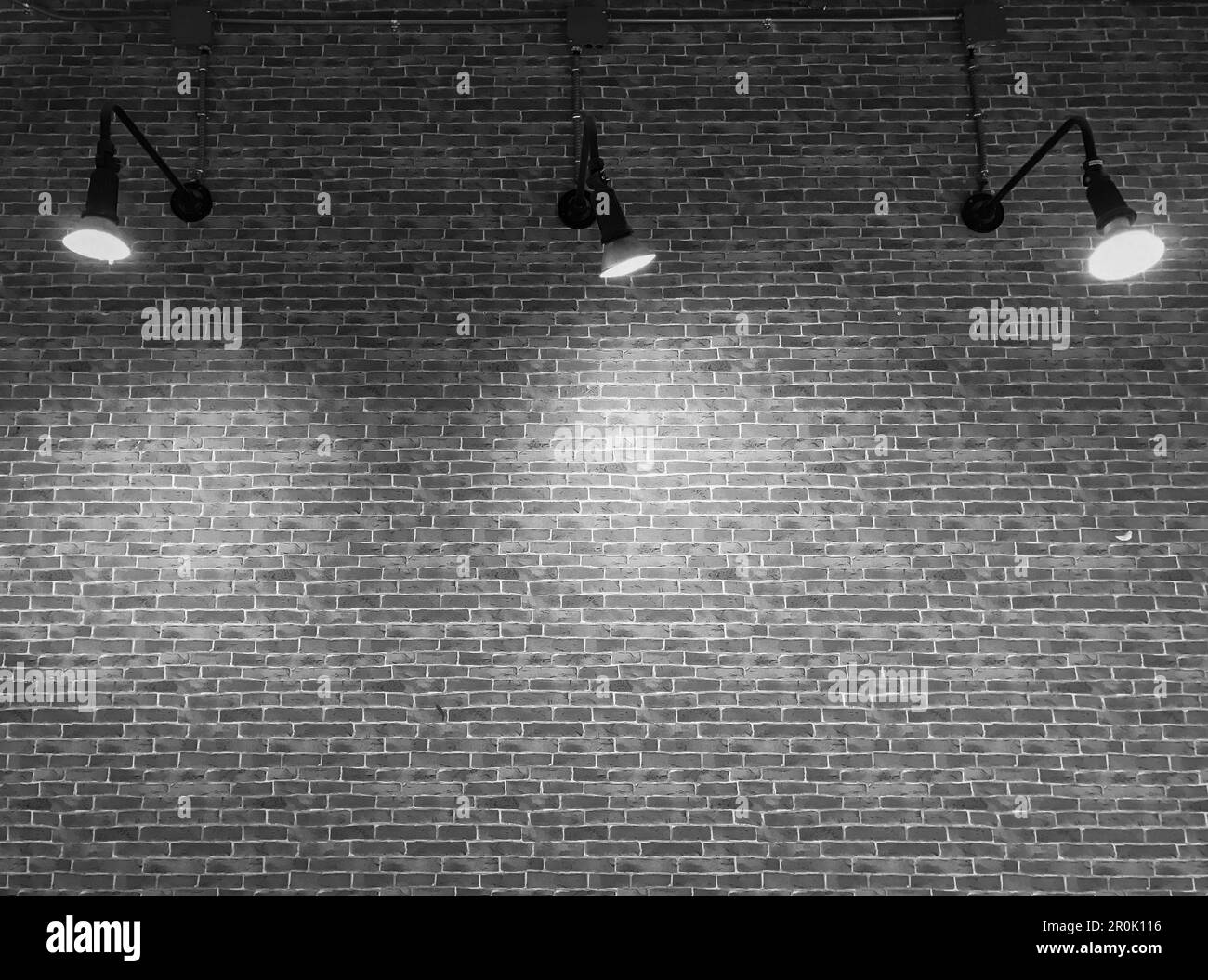 Spot light and brick background Stock Photo - Alamy