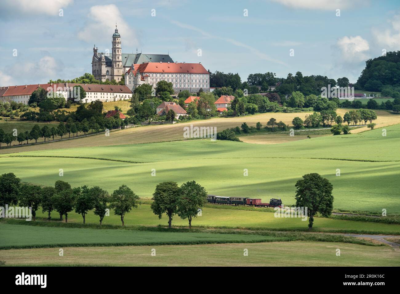 historical steam train passes Benedictine abbey at the so called ...