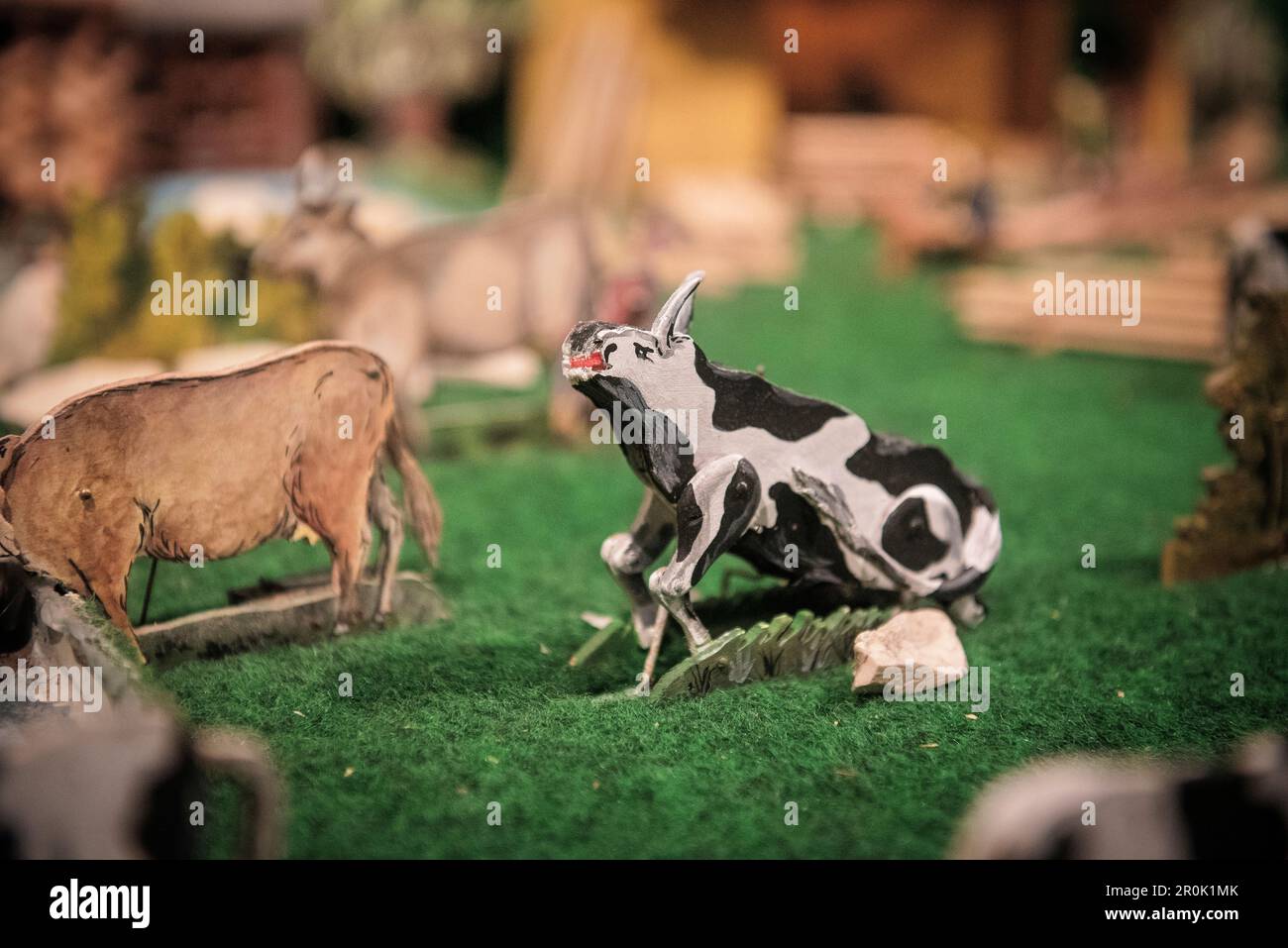 cow getting up at mechanical crib at cemetery in Blaubeuren, Alb-Danube ...