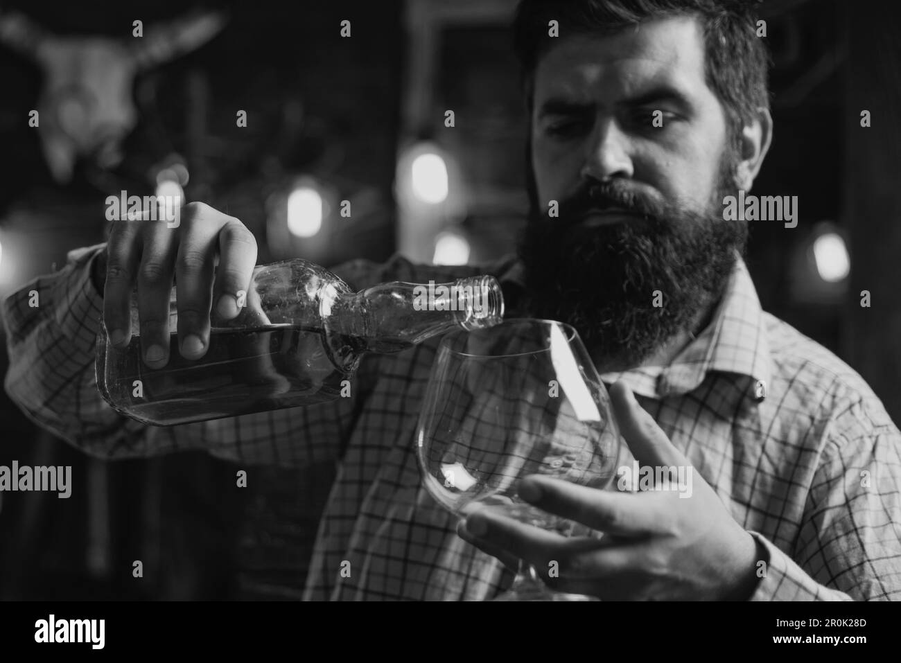 Degustation tasting expensive whiskey. Bearded man with glass of ...