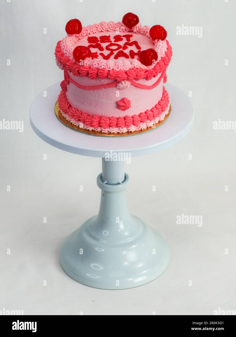 frosted pink red cake for mothers day celebration with funny text ...