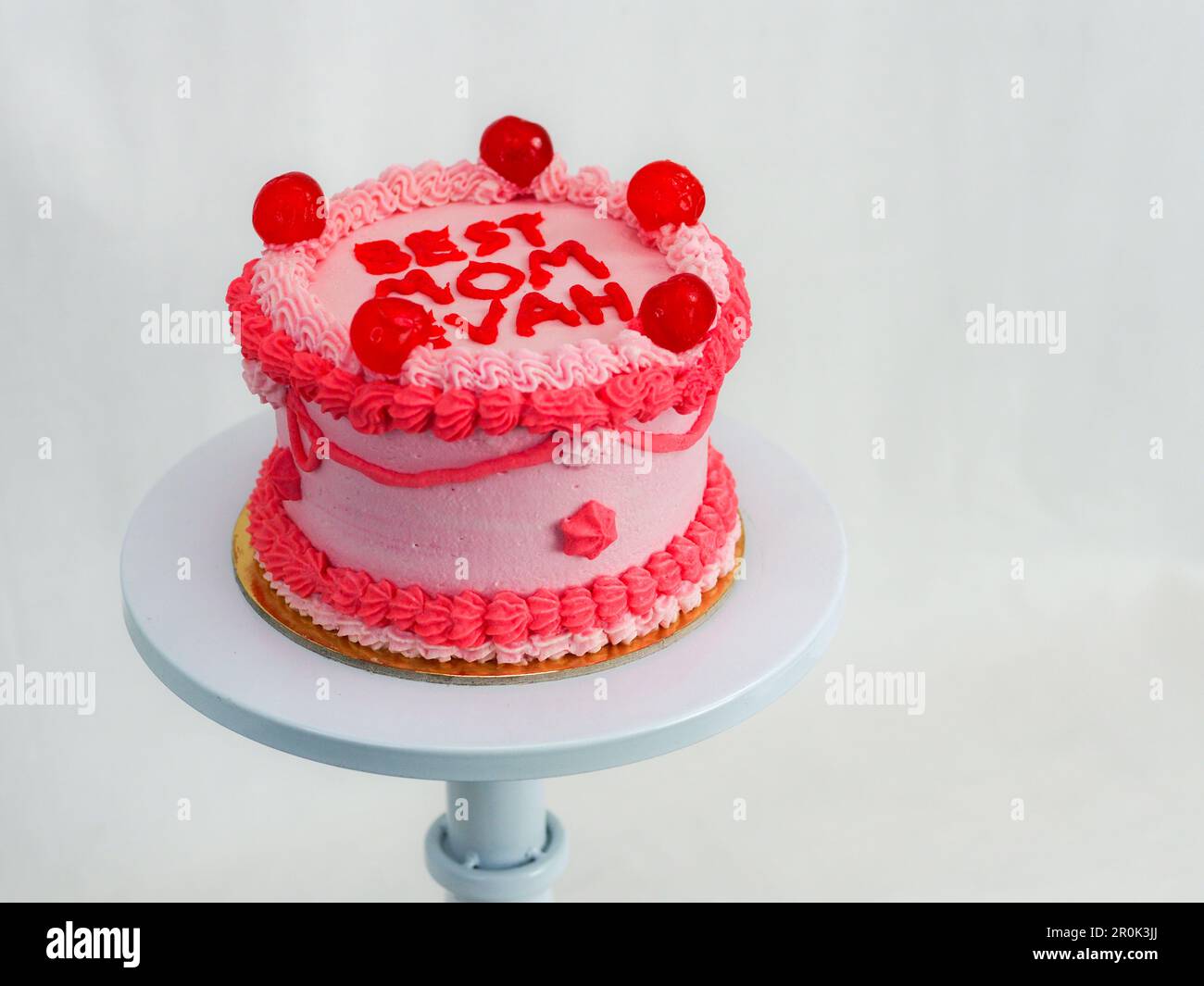 frosted pink red cake for mothers day celebration with funny text ...
