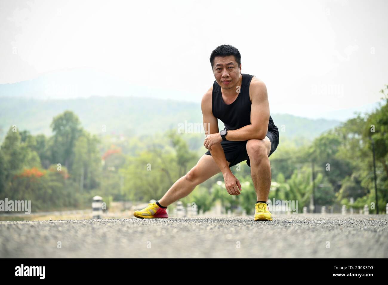 Mature asian man stretching hi-res stock photography and images - Alamy