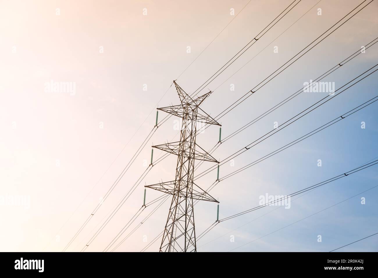 High voltage post tower with blue sky before sunset background Stock ...