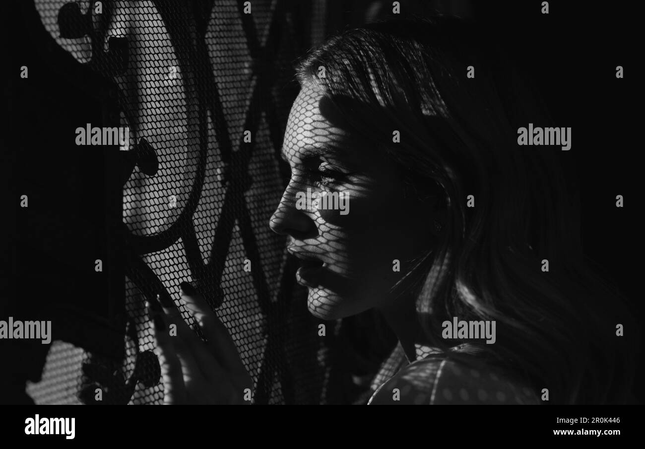 Portrait of young woman outdoor. Romantic girl with beauty face spy ...