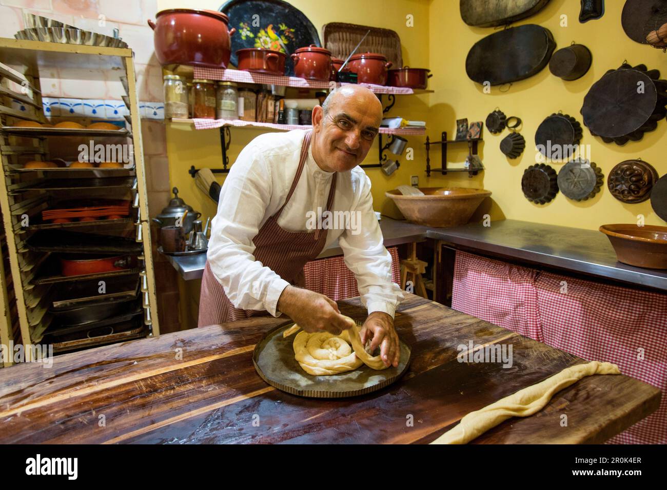 Baker Tomeu Arbona prepares traditional Ensaimada pastry at Fornet de ...