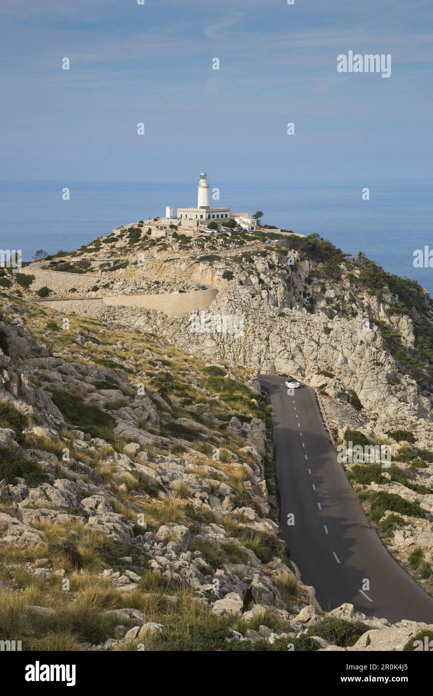 White Porsche sports car on road along Cap de Formentor peninsula with ...