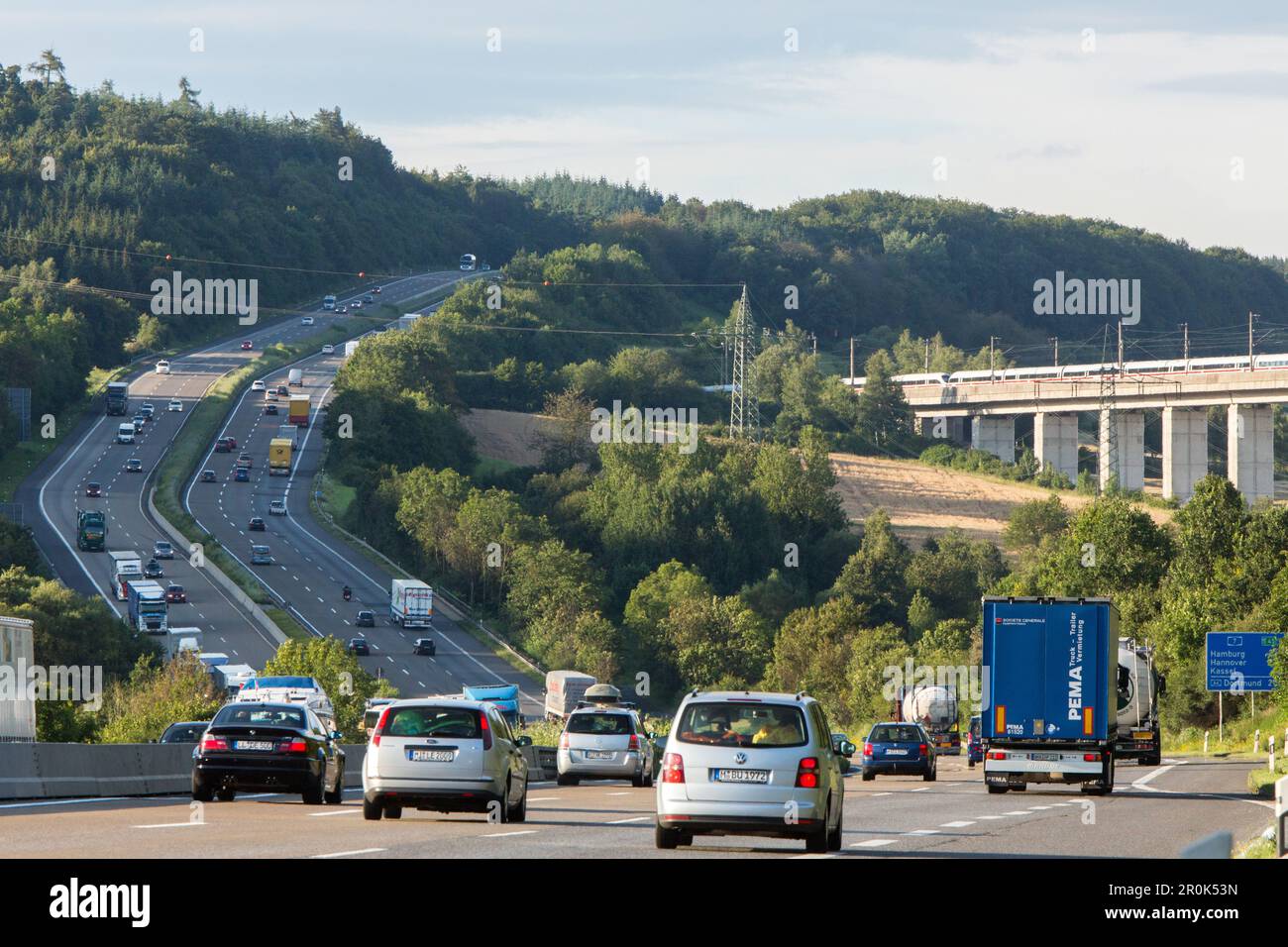 German Autobahn, A 7, high speed train lines, pillars, supports, forest ...