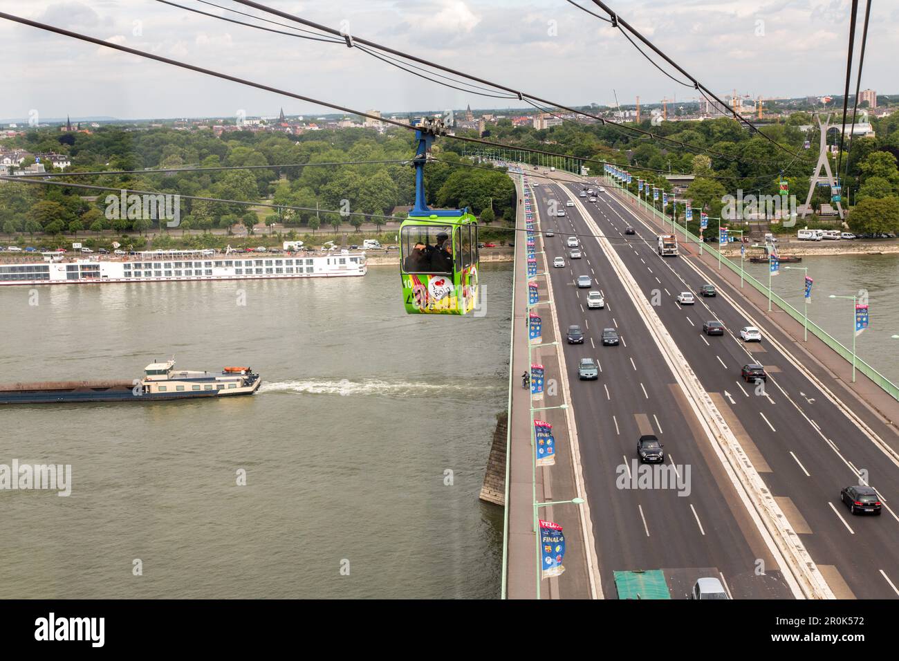 German Autobahn approach road, cable cars cross Rhine bridge, Zoo ...