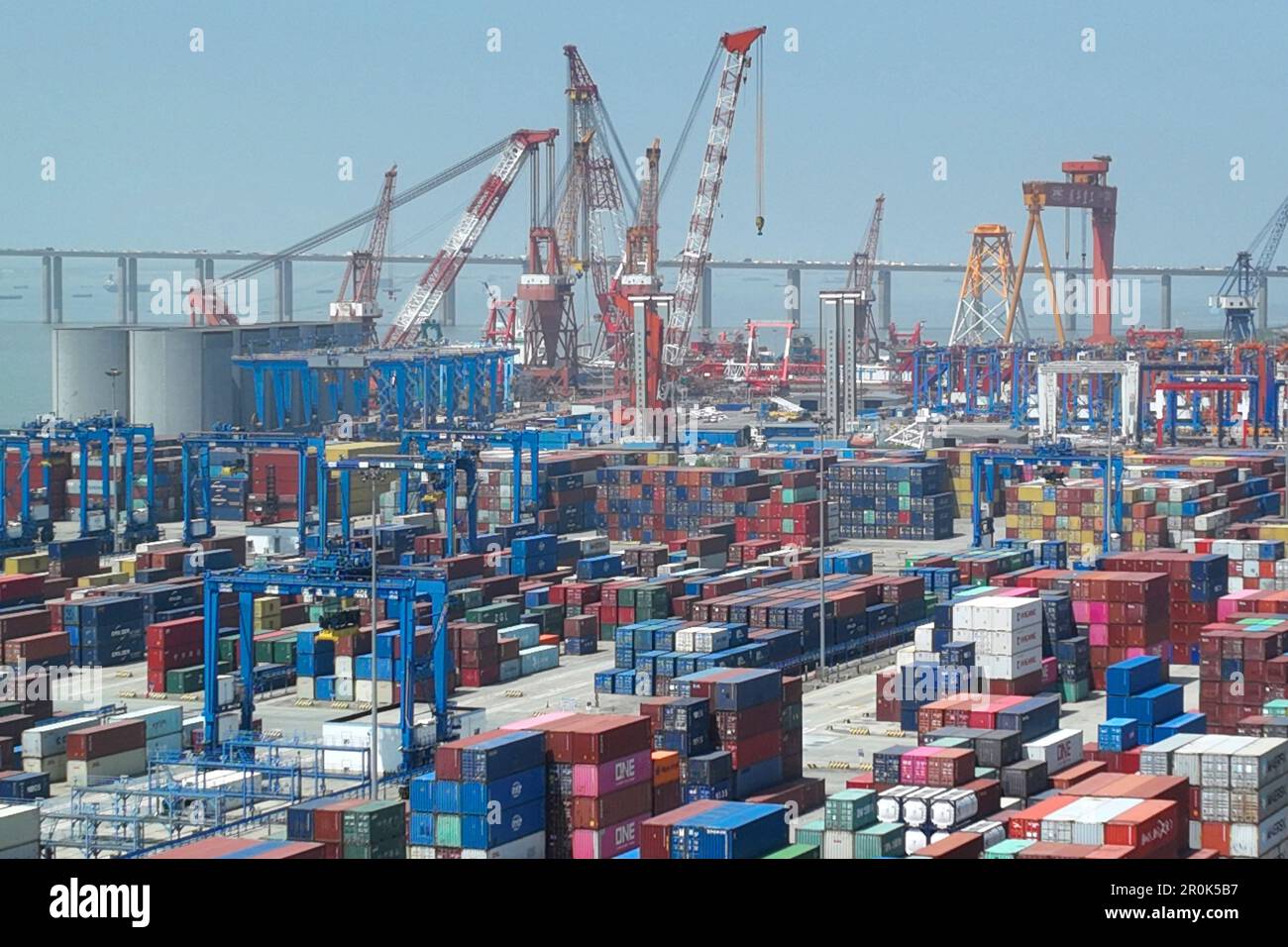 Shipping containers are stacked on a dock at a port in Nantong in ...