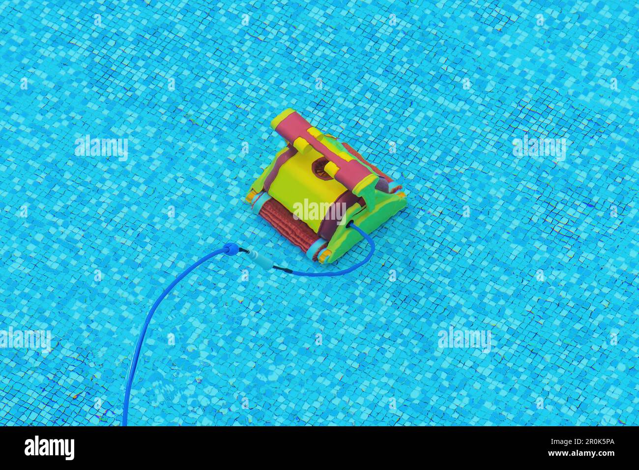 Robotic swimming pool cleaner in operation at the bottom of the pool ...