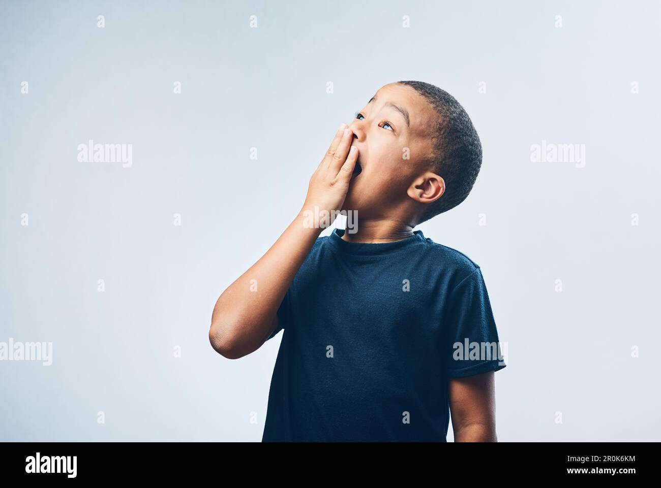 Woah thats a huge rollercoaster. Studio shot of a cute little boy ...