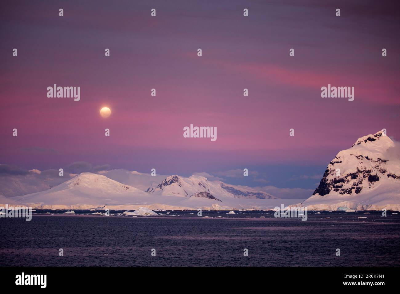 Full moon over snow capped hi-res stock photography and images - Alamy