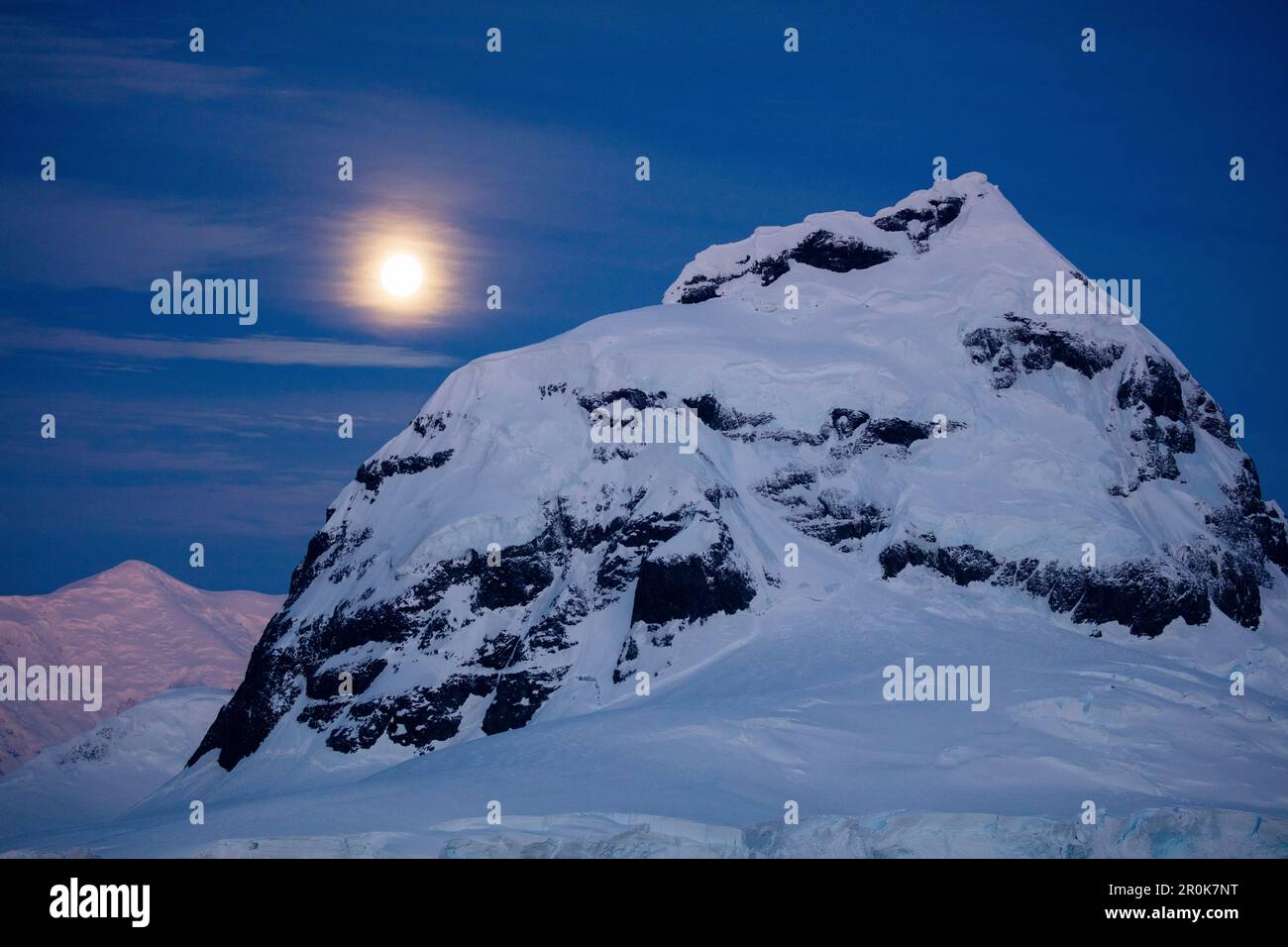Full moon over snow capped hi-res stock photography and images - Alamy