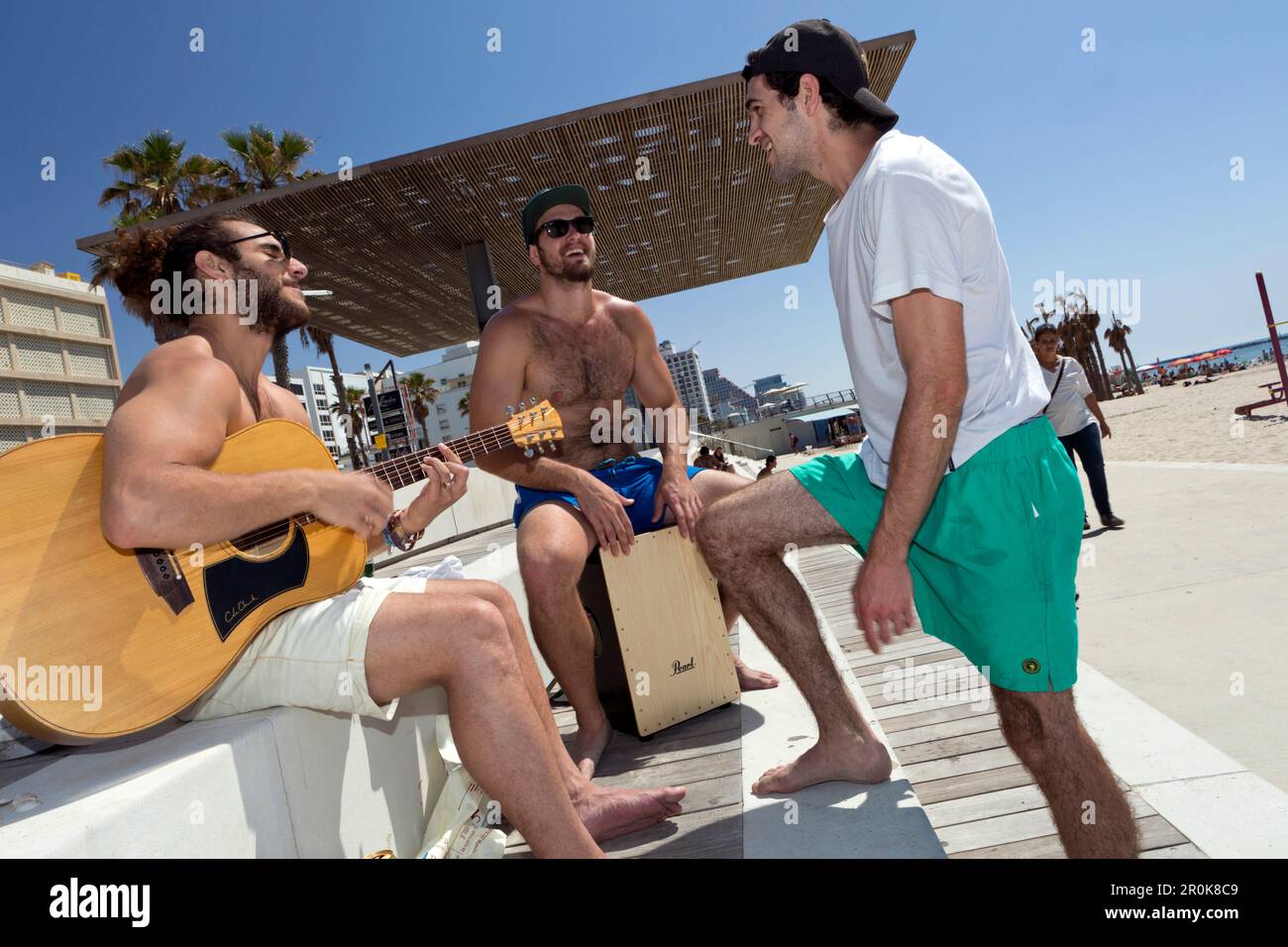 Young men playing music on the Tayelet (beach promenade), Tel-Aviv ...