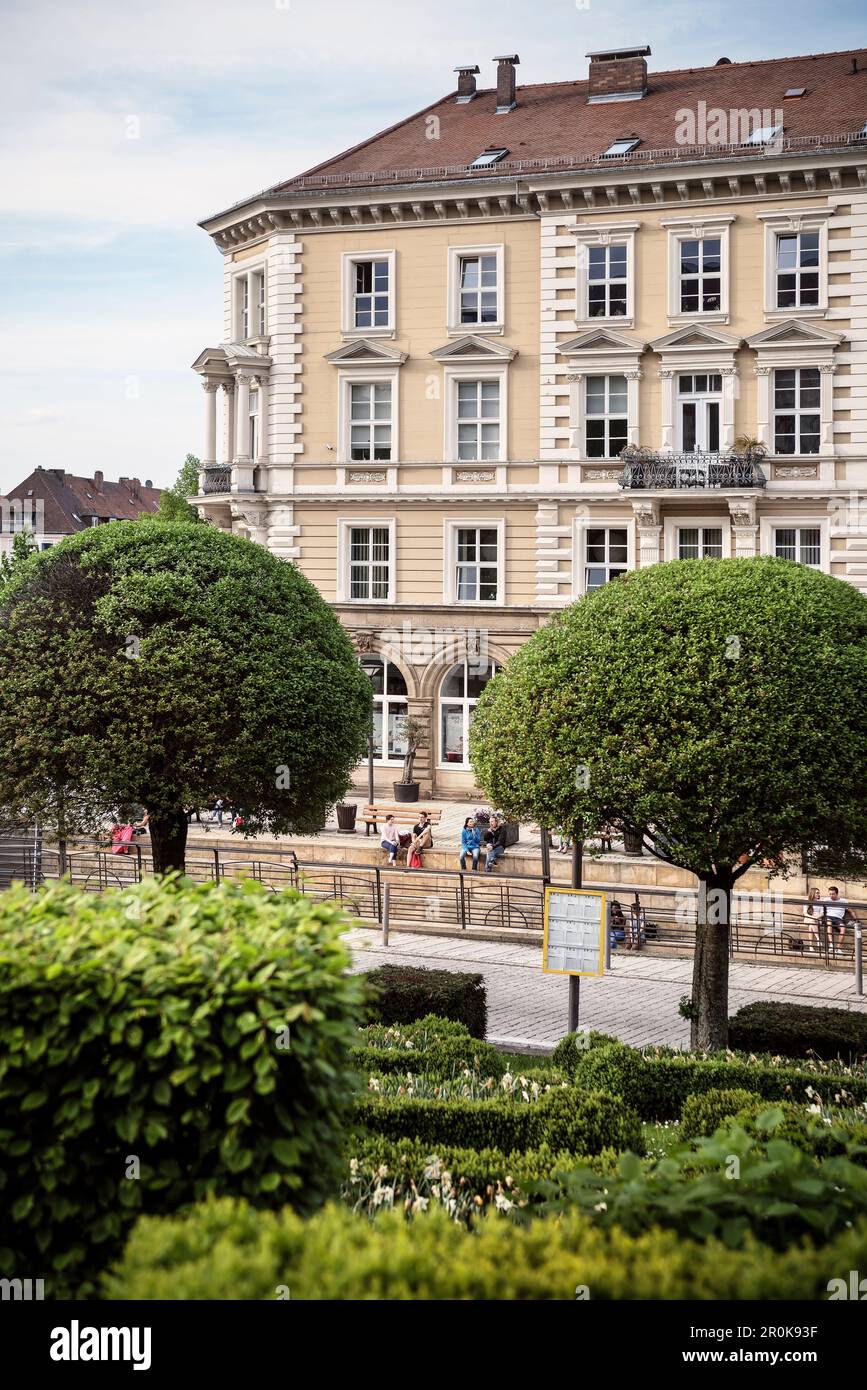 people siting at rivulet ''Red Maine'' in front of baroque building ...